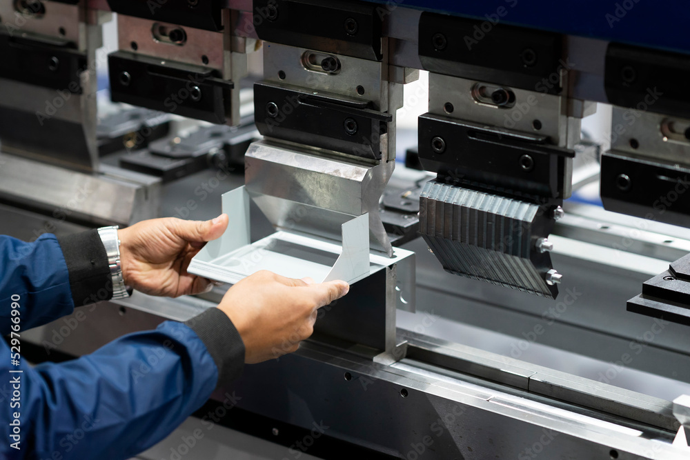 operator bending metal sheet by sheet bending machine Stock Photo ...