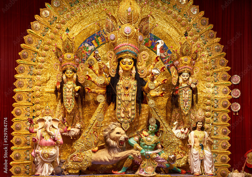 Divine idol of Hindu Goddess Durga slaying buffalo demon Mahishasura ...
