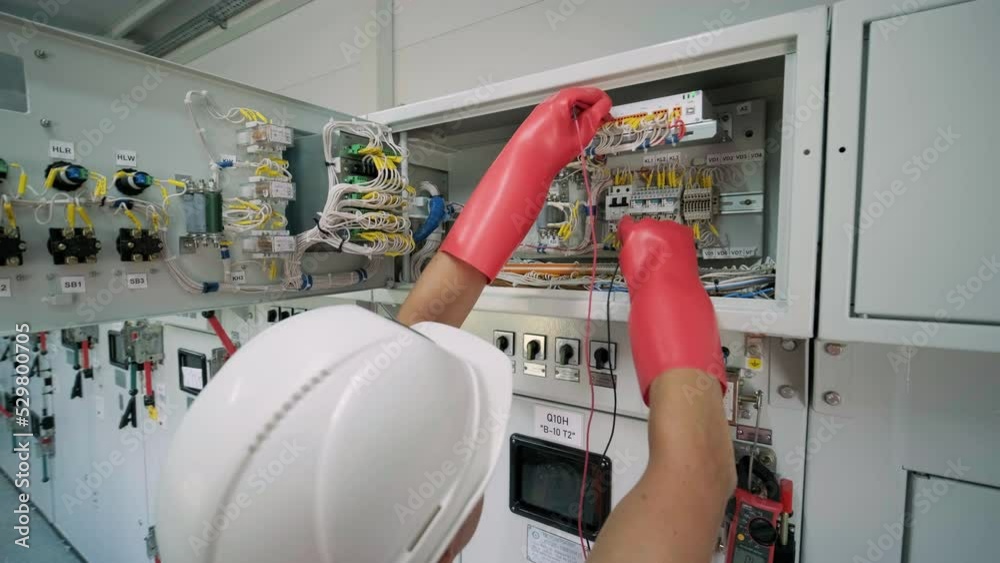 Electrical engineer working check the electric current voltage and ...