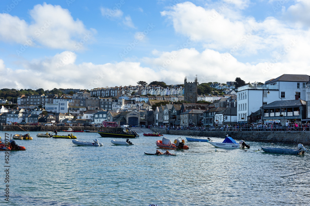 St Ives, harbour with boats and high tide. Popular seaside town and port in Cornwall August 28 ...
