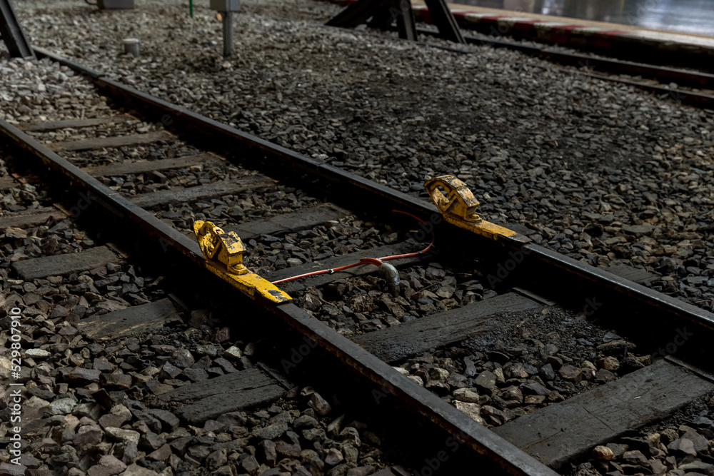 Train stopper or Train bumper installed on track for break. Train ...
