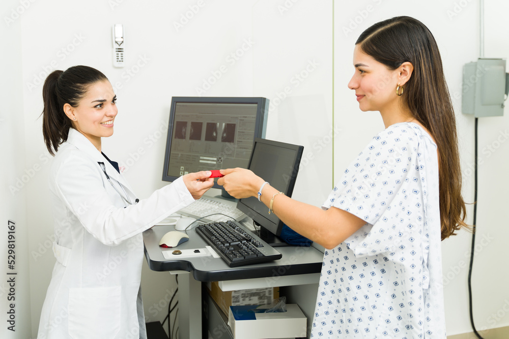 Female patient receiving the mammogram test results at the imaging lab ...