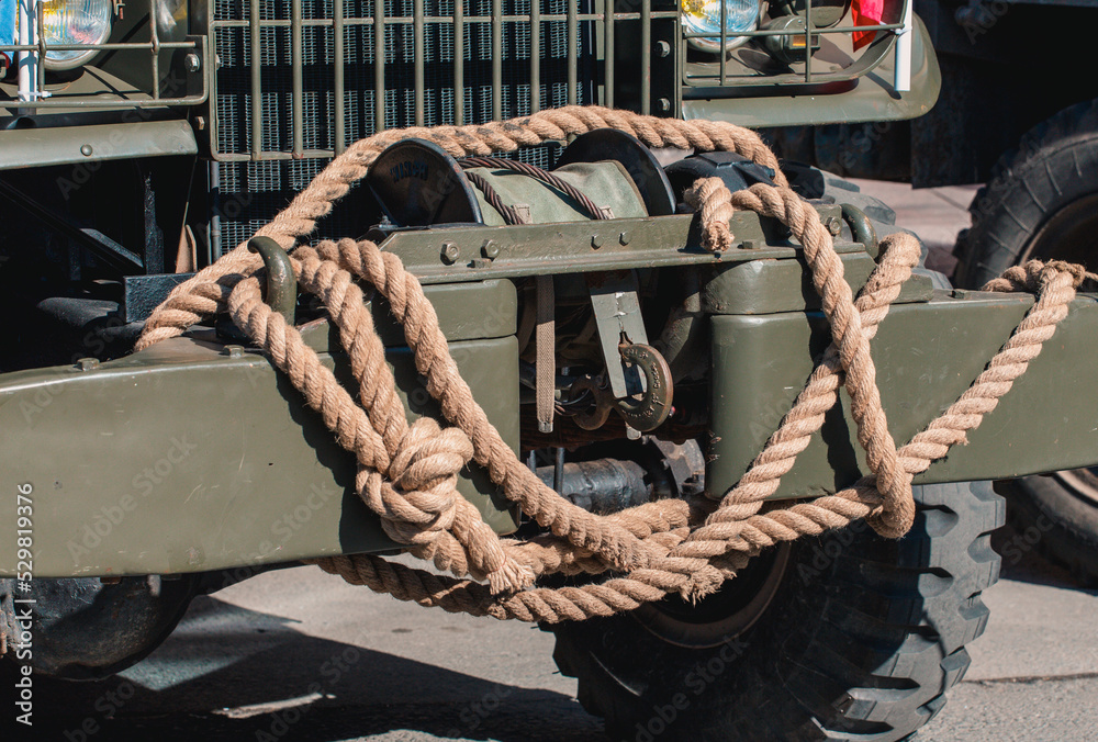 Powerful car winch with rope. Metal cable winch. Winch with cable close ...