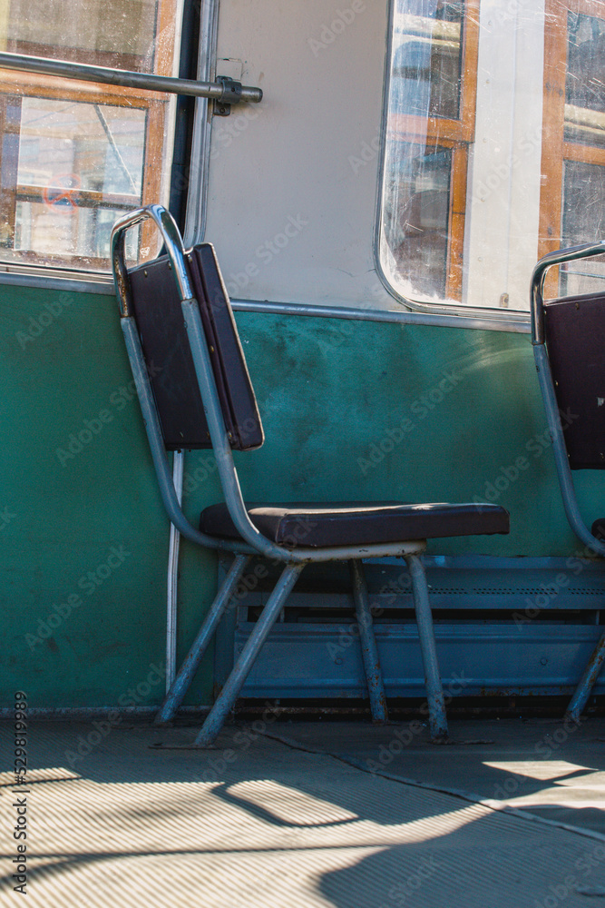 Free seats on the bus. Old brown leather bus seat. Retro bus passenger ...