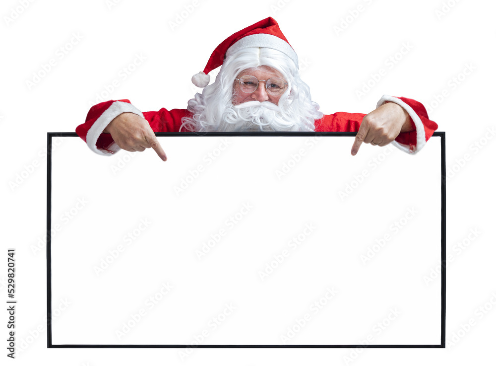 Santa Claus is holding and pointing the white blank sign for seasonal ...