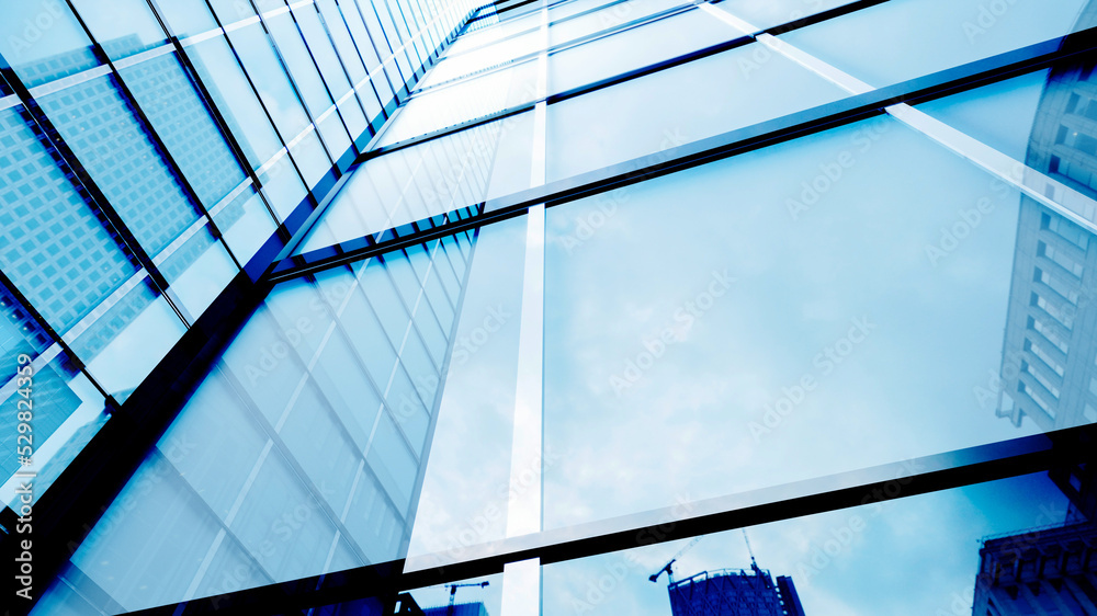 Glass buildings business concept. The glass facade of a skyscraper with ...
