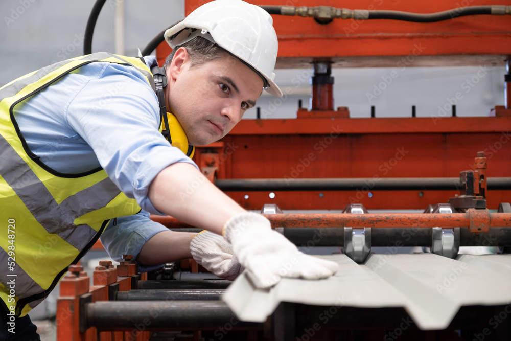 Selective focus at Caucasian men mechanical engineer, wearing safety ...
