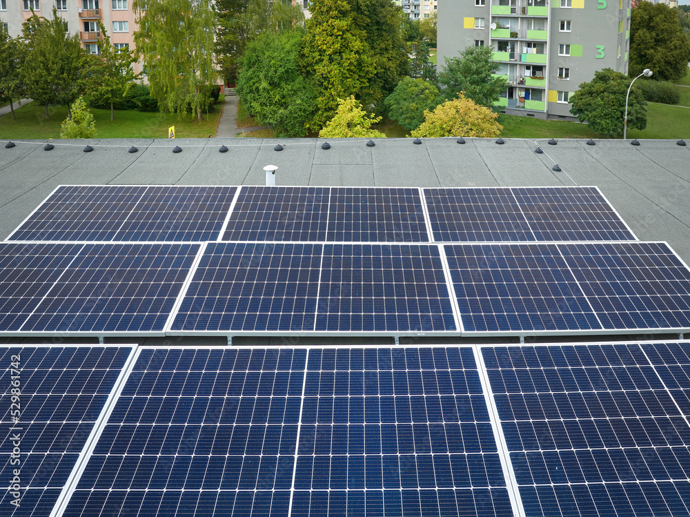 Solar power plant on the school roof. View of the photovoltaic panels ...