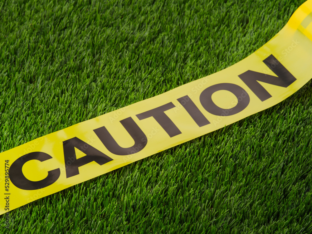 Stockfoto Yellow tape with the inscription - caution. Isolated on a ...