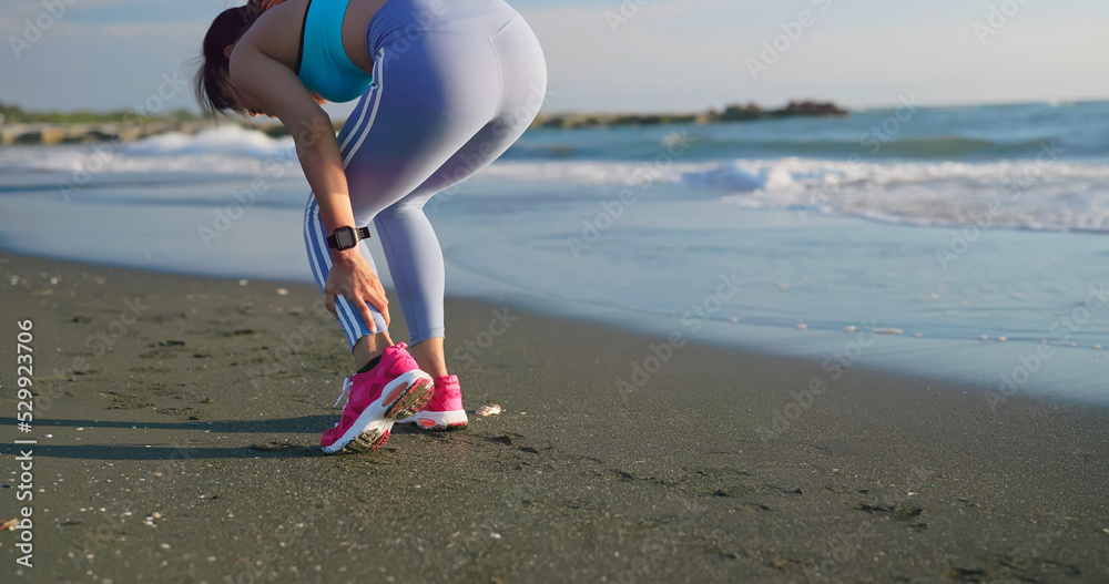 female runner has leg cramp Stock Photo | Adobe Stock