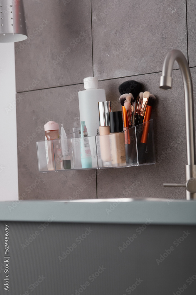 Close-up shoot of a transparent universal organizer with 5 compartments ...