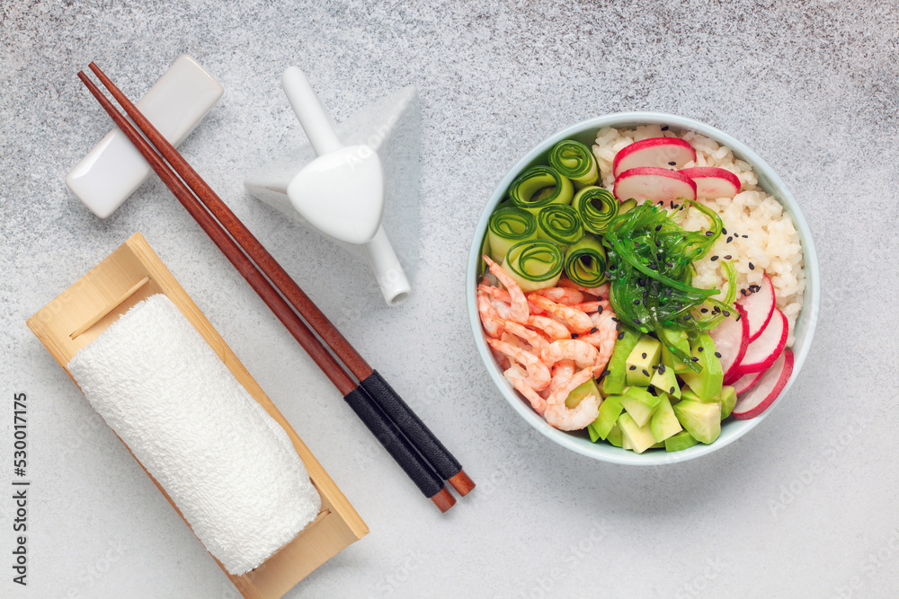 Hawaiian poke bowl with shrimp, cucumber, radish, avocado and chuka ...