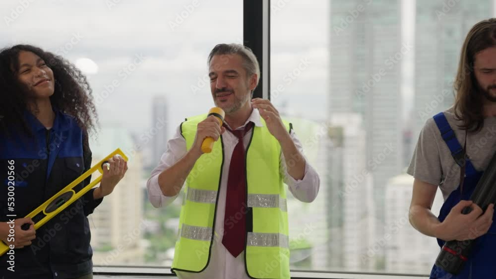 Group of successful engineer worker enjoying working dancing together ...