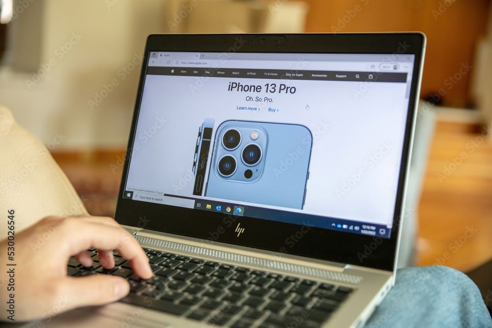 IPHONE 13 pro. App, smartphone presentation. Laptop computer on blur ...