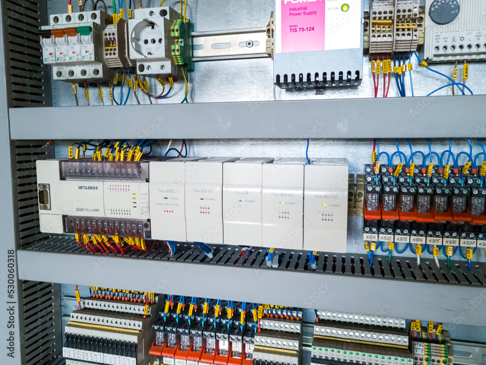 Mitsubishi PLC modules in a row in electrical cabinet of automation ...