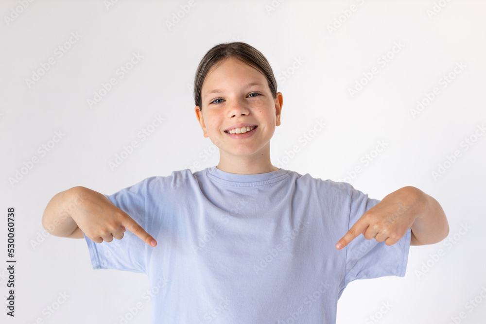 Portrait of happy preteen girl pointing at herself. Caucasian child ...