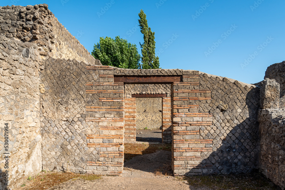 Doors viewed in sequence inside ruins of ancient house in Pompeii Stock Photo | Adobe Stock