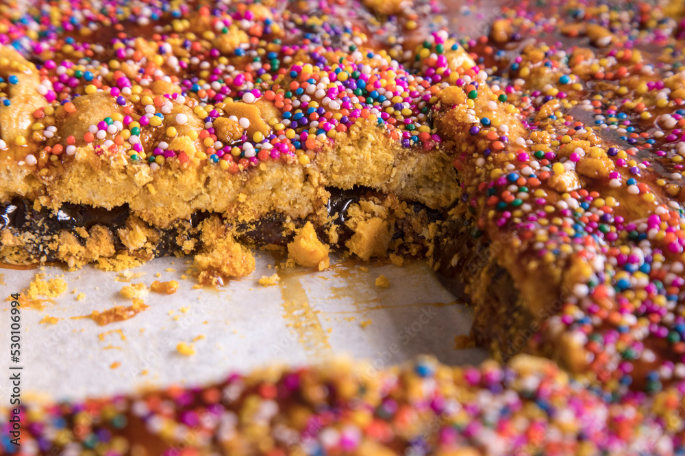 Girl eating Turron dona pepa dough with honey traditional peruvian ...