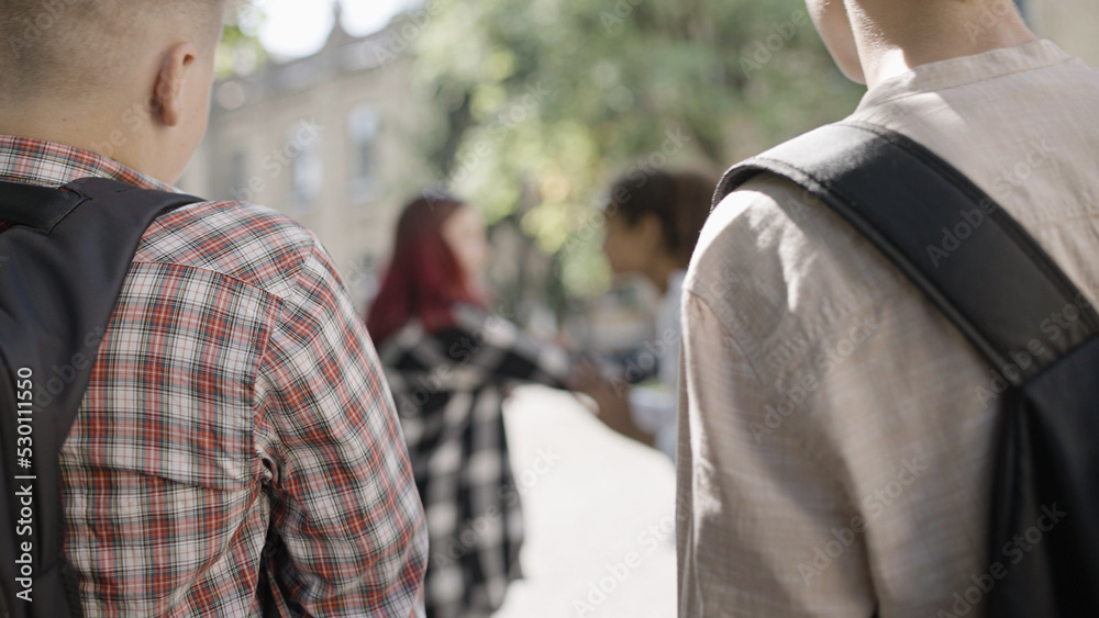 Foto de Classmates watching two school girls fight, bullying problem ...