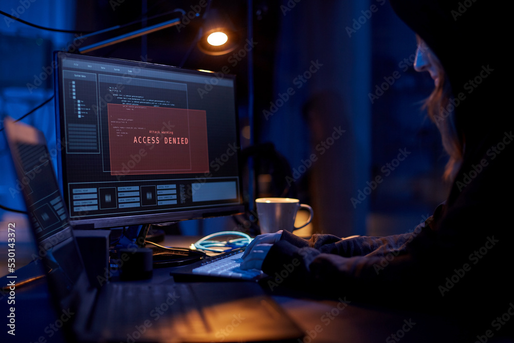 cybercrime, hacking and technology concept - close up of female hacker ...