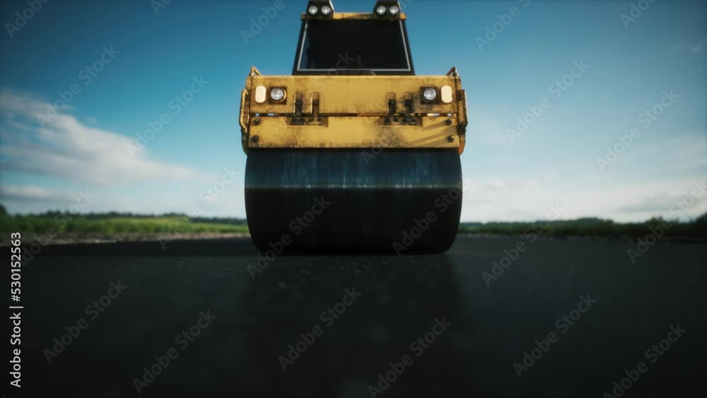 Construction of a new road. Asphalt paver machine on a road ...