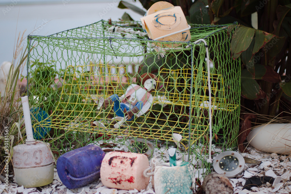 Cowboy Skeleton trapped in Crab Cage with Buoys Displayed Outside Stock ...