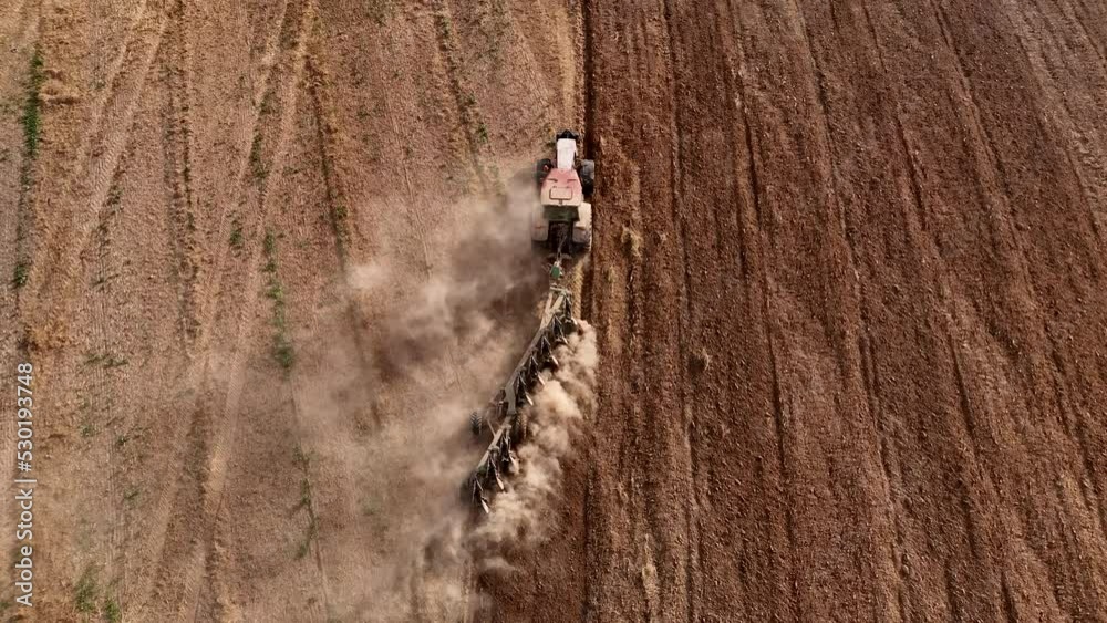 Tractor with disc cultivator on land cultivating. Disk harrow on ...