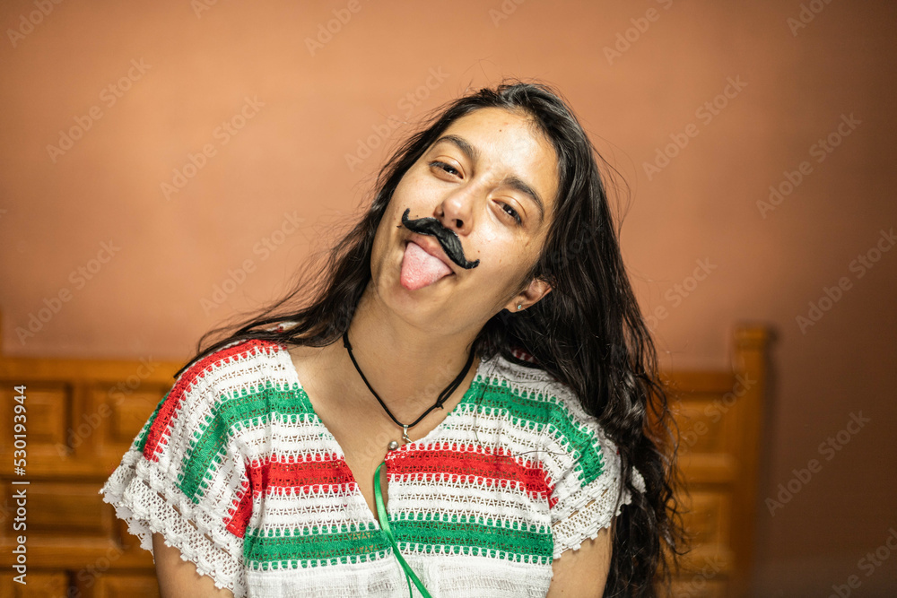 Mexican woman dressed in clothes of the patriotic colors with a fake ...