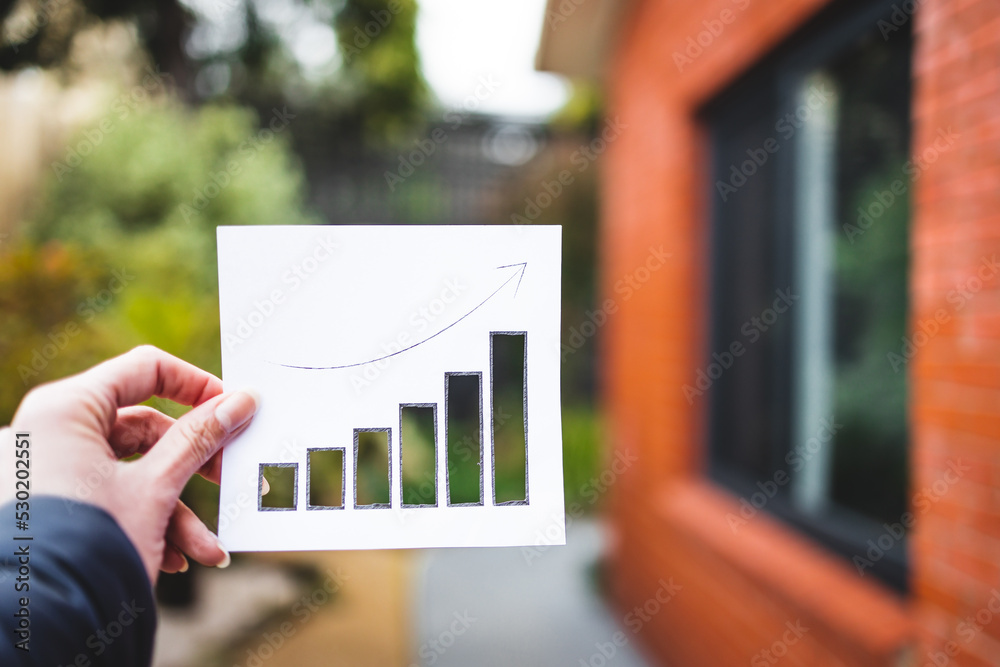 property value and return on investment or rent price, hand holding ...