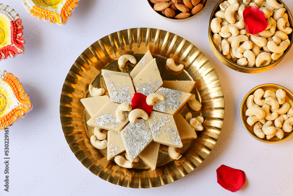 Kaju Katli Kaju Barfi Burfi cashew fudge candy woman hand serving ...