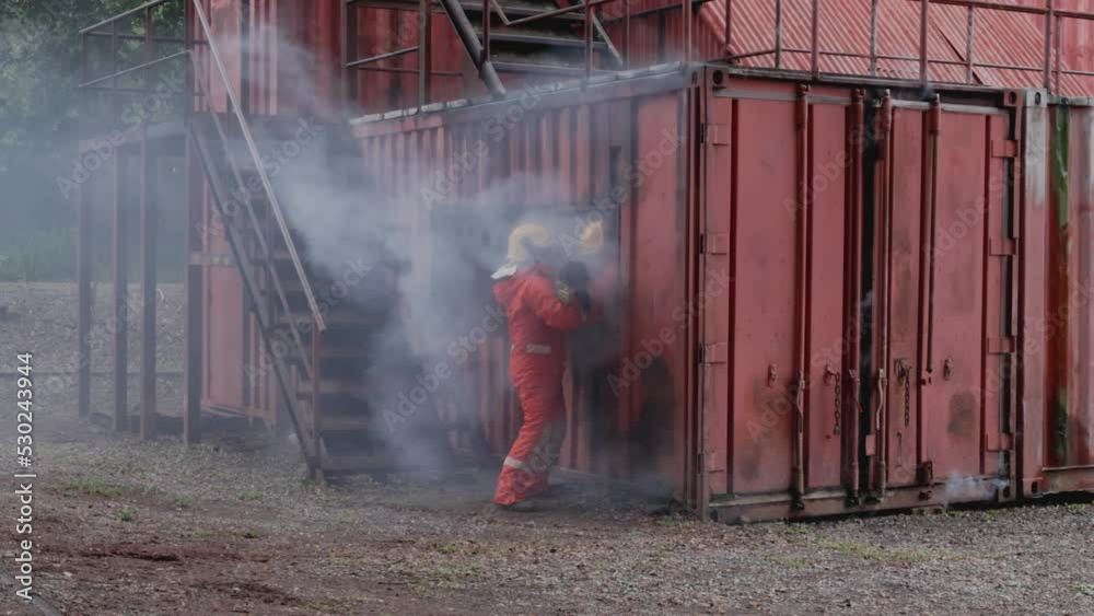 Firefighters wearing helmets with fire safety equipment Use Twirl ...