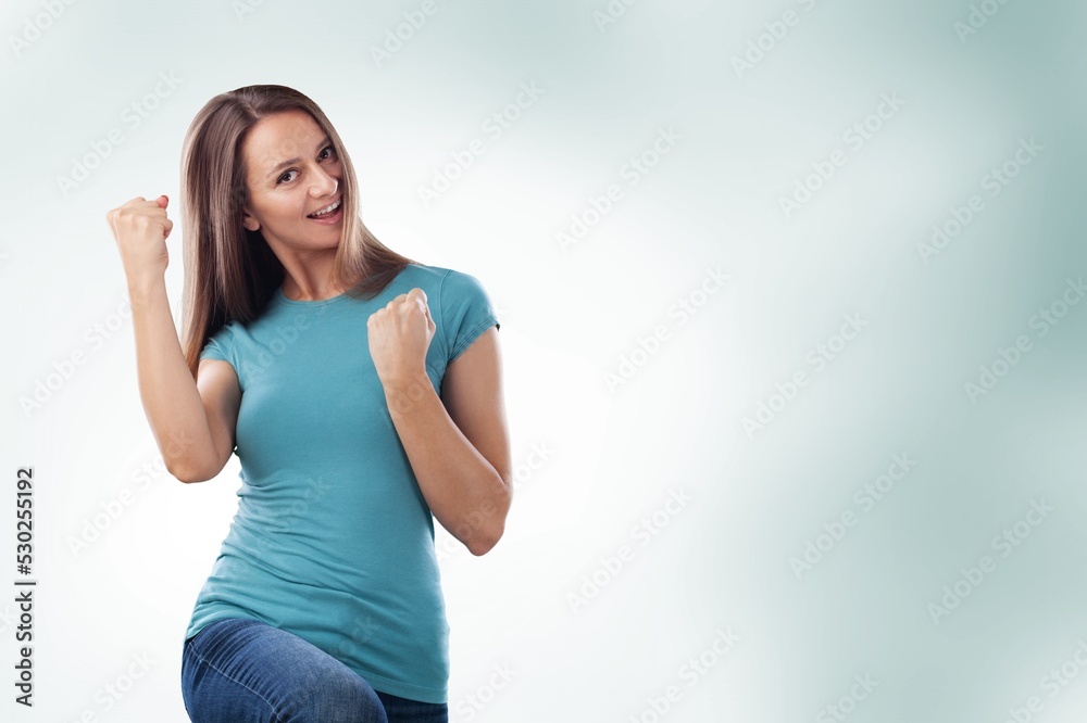 Excited young women in celebrate pose Stock Photo | Adobe Stock