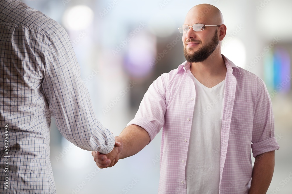 Business partnership. Male entrepreneurs shaking hands, celebrating ...
