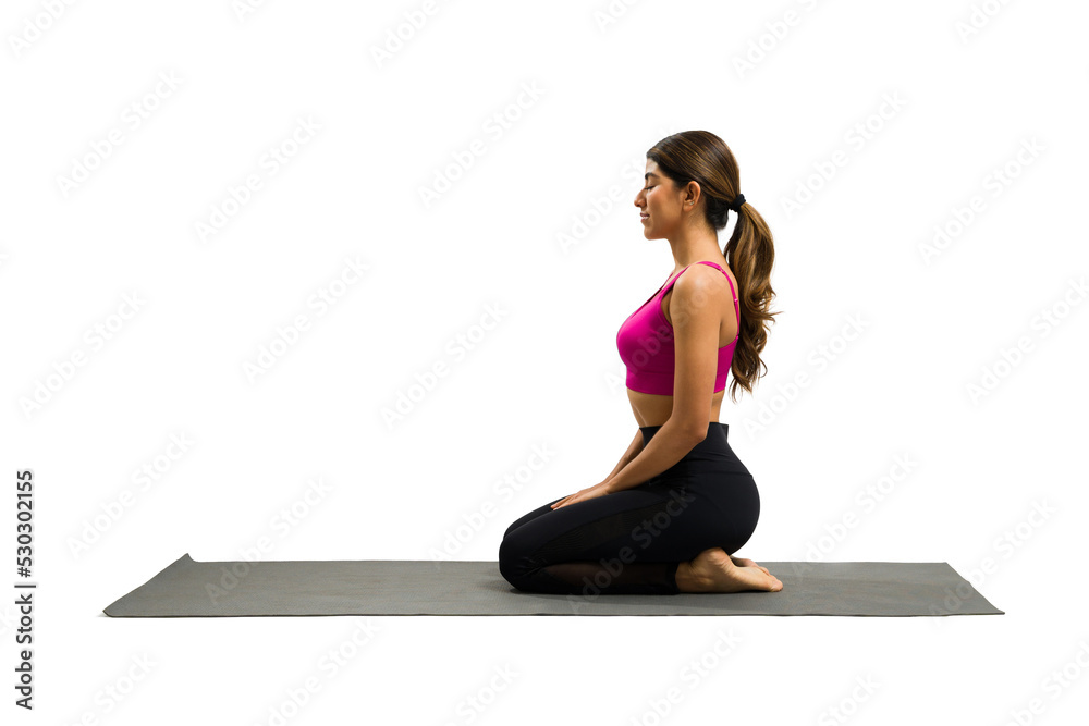 Relaxed woman doing breathing exercises on a thunderbolt yoga pose ...