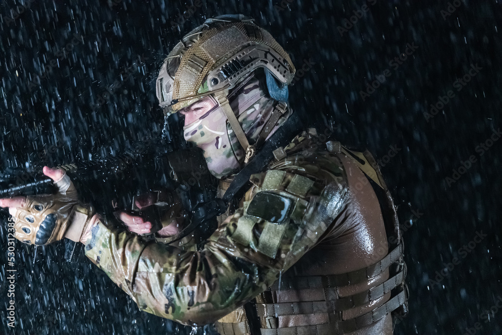 Army soldier in Combat Uniforms with an assault rifle, plate carrier ...
