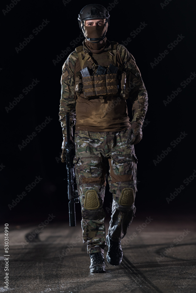 Army soldier in Combat Uniforms with an assault rifle, plate carrier ...