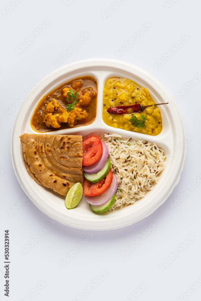 Indian mini meal parcel platter or combo thali with Gobi Masala, roti ...