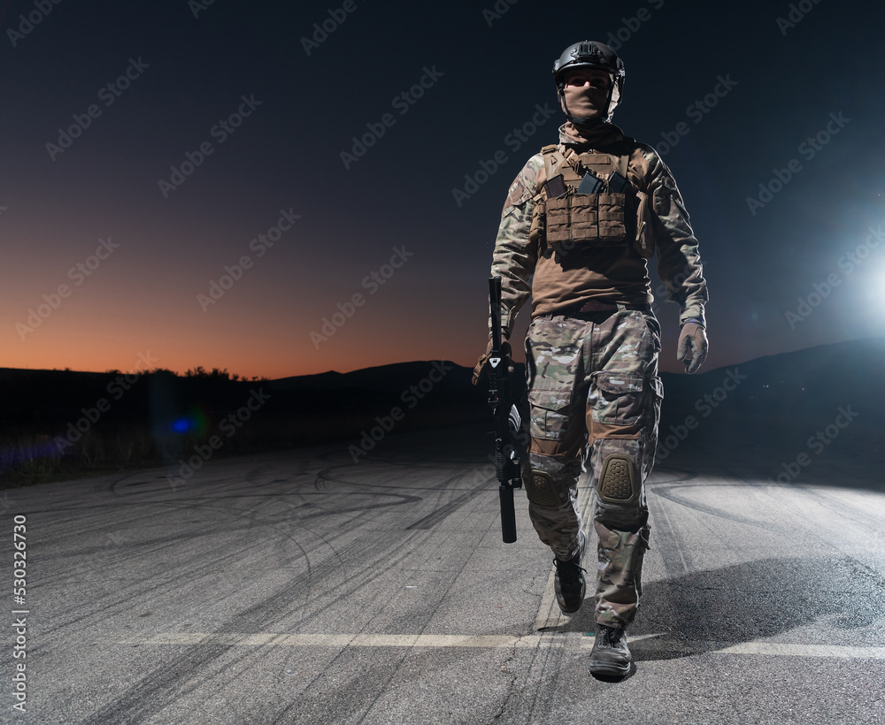 Army soldier in Combat Uniforms with an assault rifle, plate carrier ...