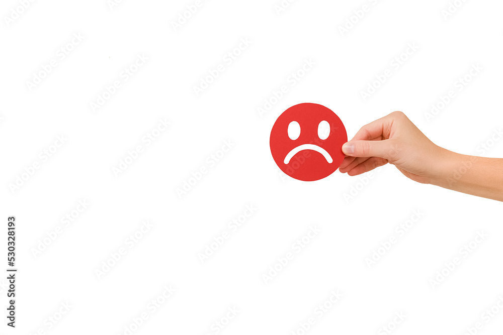 Female hand holding red angry face emoticon, isolated on white ...