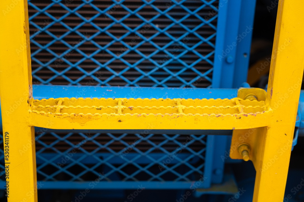 Metal fixed ladder of the construction working platform with safety ...