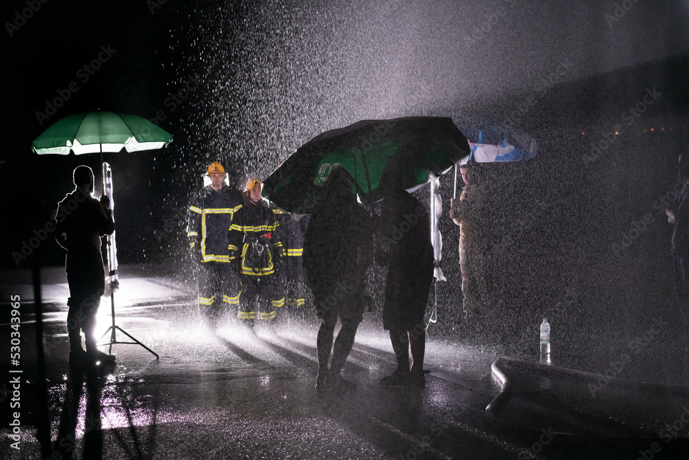 Behind the scene of Firefighters photo and cinema set with rain use a ...