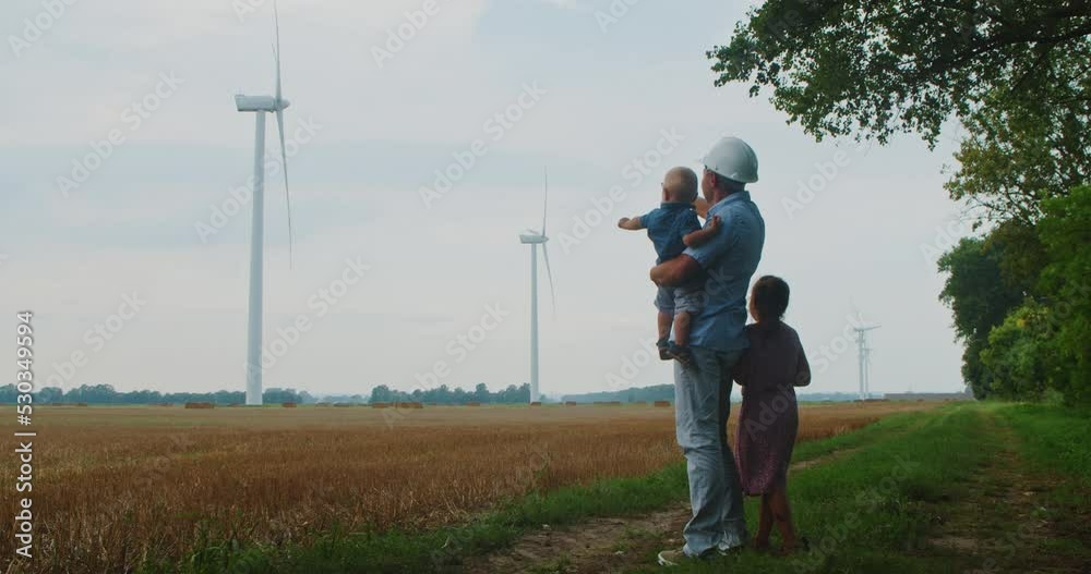 Young engineer father with children holding his daughter hand and ...