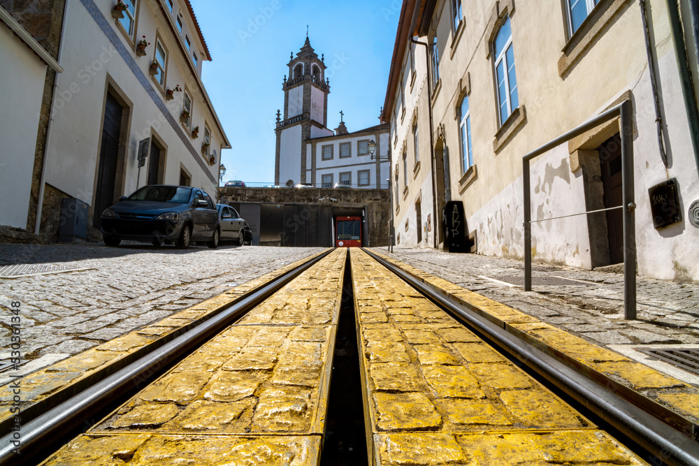 Tram track and tram car parked at the base from the point of view of ...