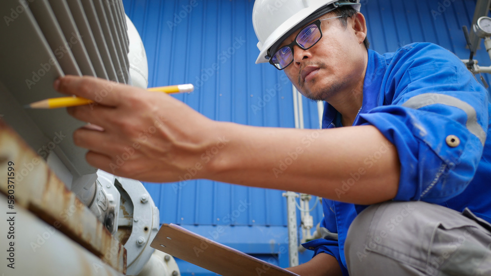 Industrial electrician wearing safety helmet Visual check Induction ...