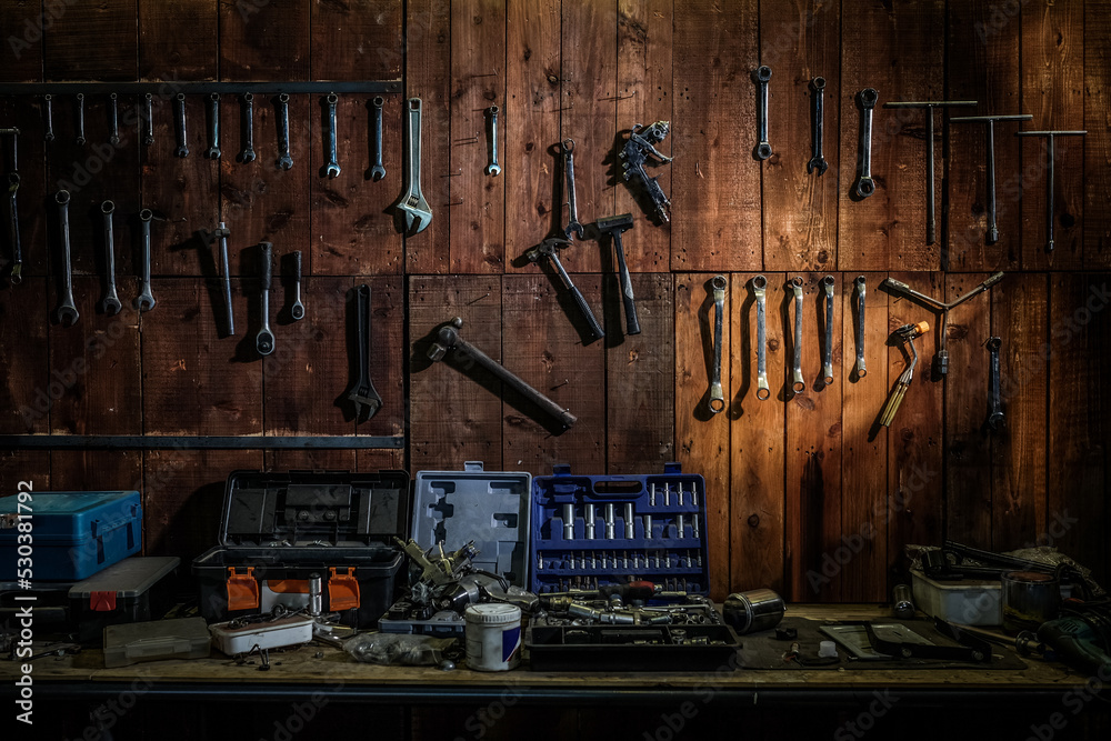 Workshop scene. Old tools hanging on wall in workshop, Tool shelf ... Workshop scene. Old tools hanging on wall in workshop, Tool shelf ...