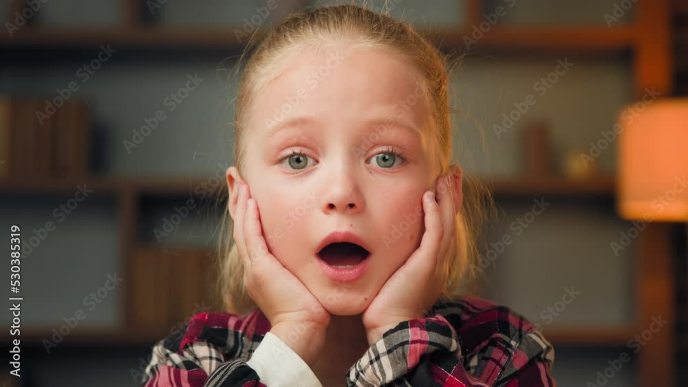 Portrait surprised caucasian teen girl shocked joyful kid with amazement on face by unexpected ...