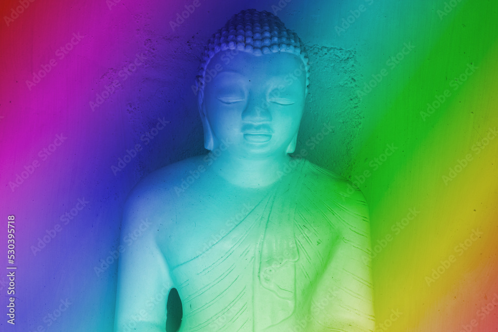 Buddha sculpture tinted in all colors of the rainbow. Stock Photo ...