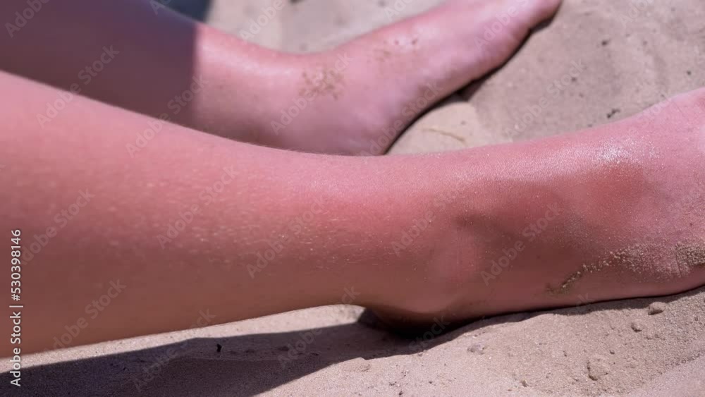 Tanned Red Bare Child Feet on Sand Lies on a Sandy Beach on Seashore ...