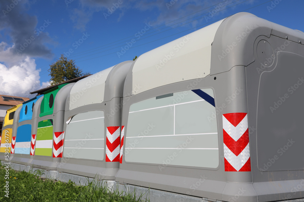 Five bins for separate waste collection where you can throw away ...