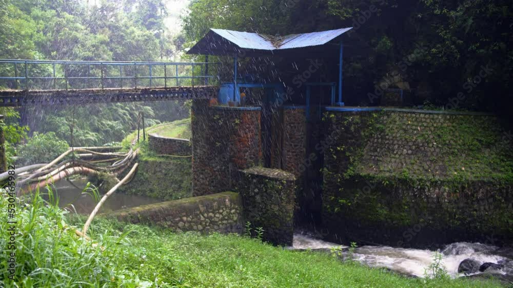 static footage of weir or overflow dam and steel bridges deep inside ...